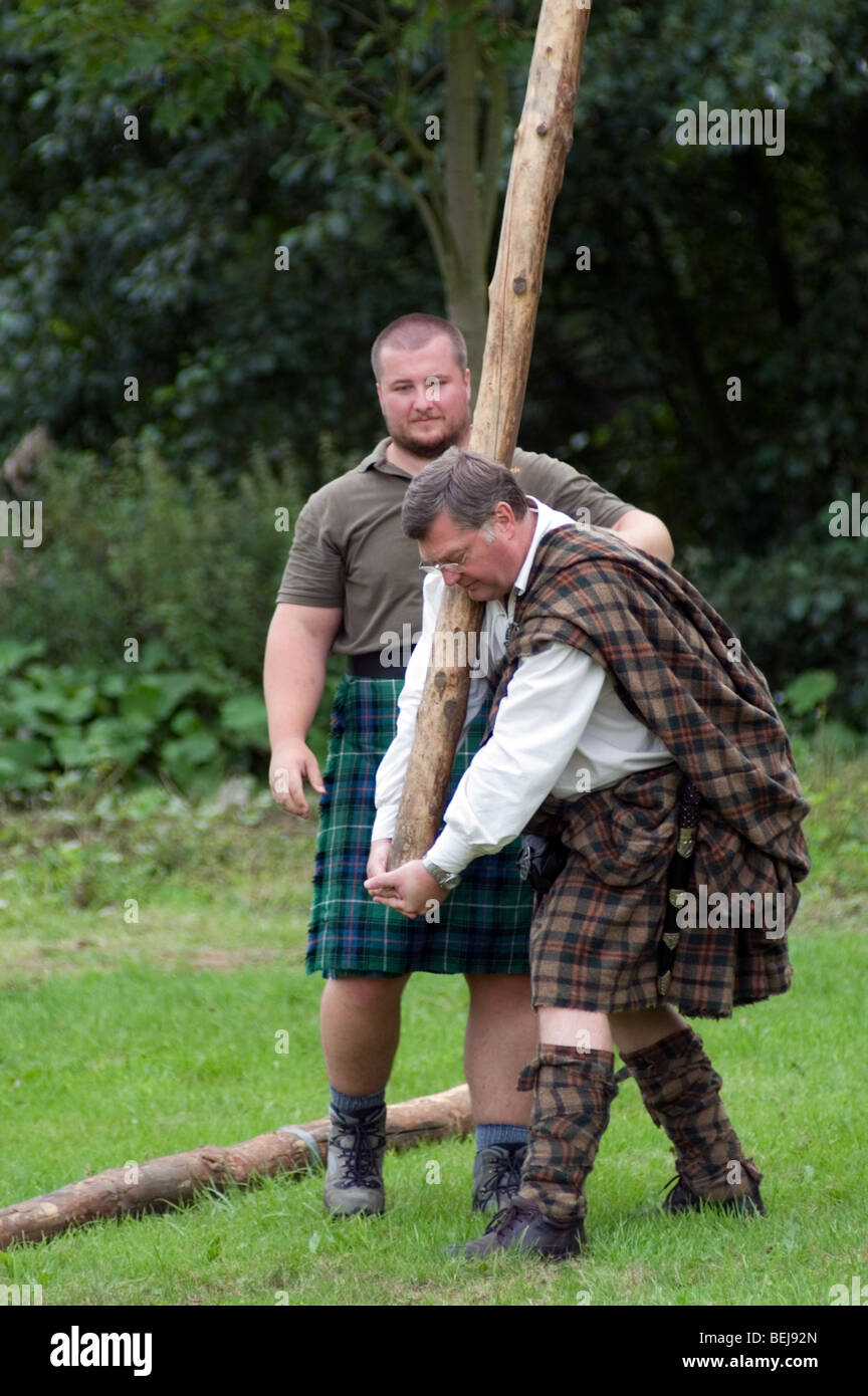 Tossing the caber during the Highland Games at the Castle of Ooidonck ...