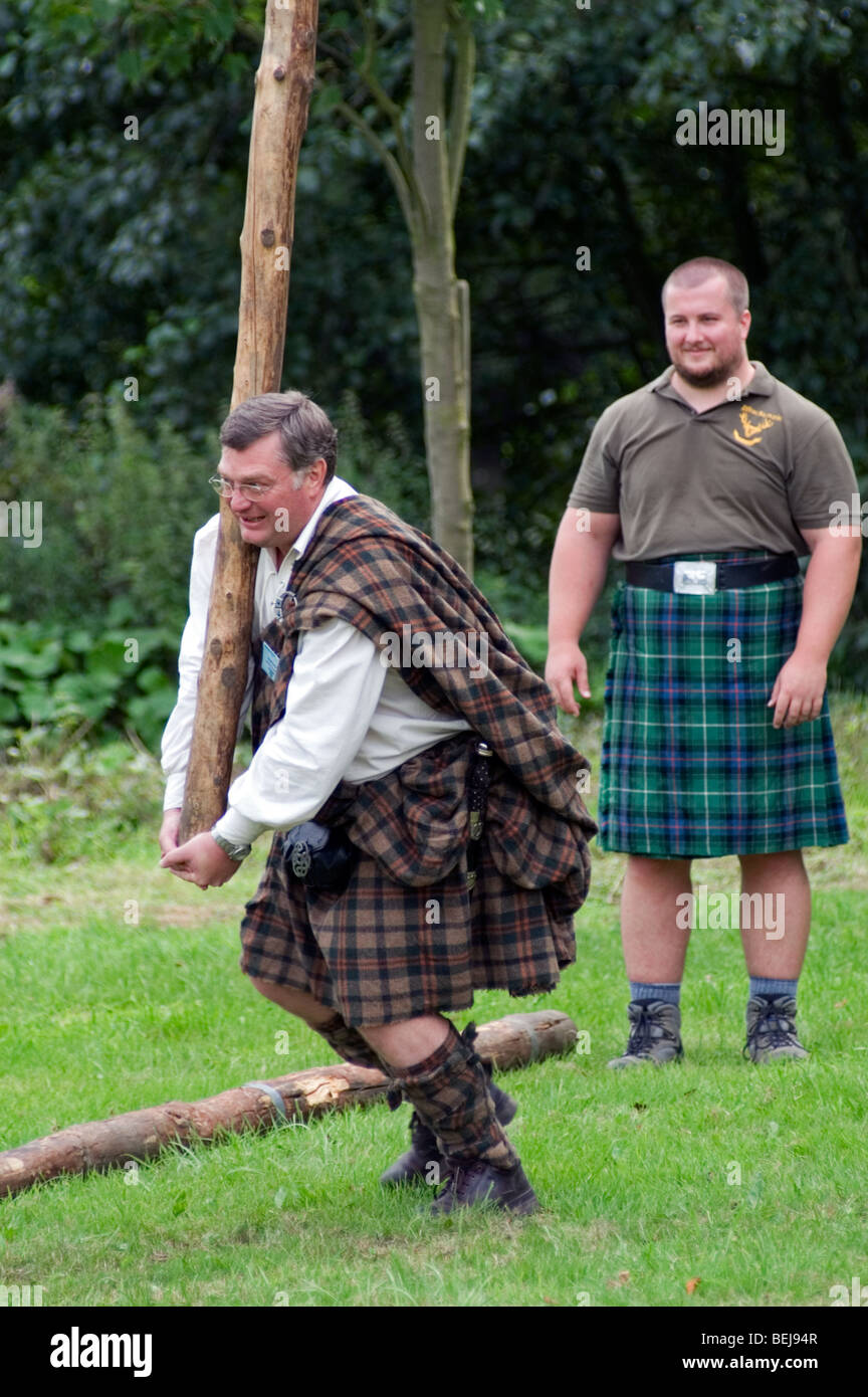 Tossing the caber during the Highland Games at the Castle of Ooidonck ...