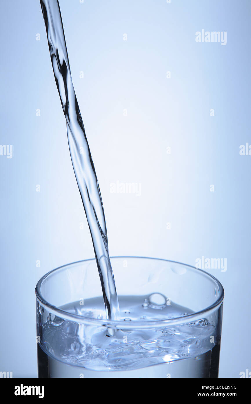 Water Pouring into a Glass Stock Photo - Alamy