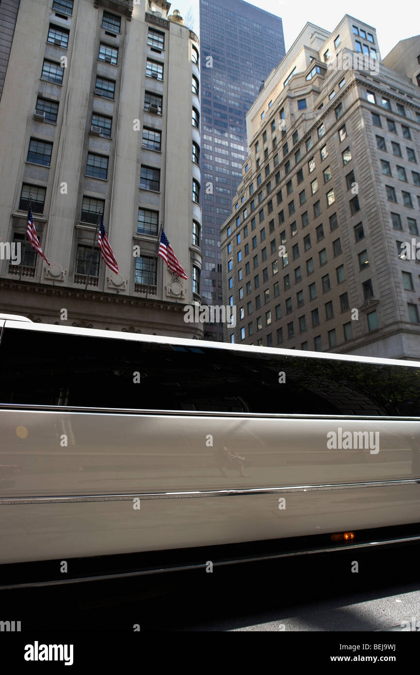 Train moving in front of buildings Stock Photo - Alamy