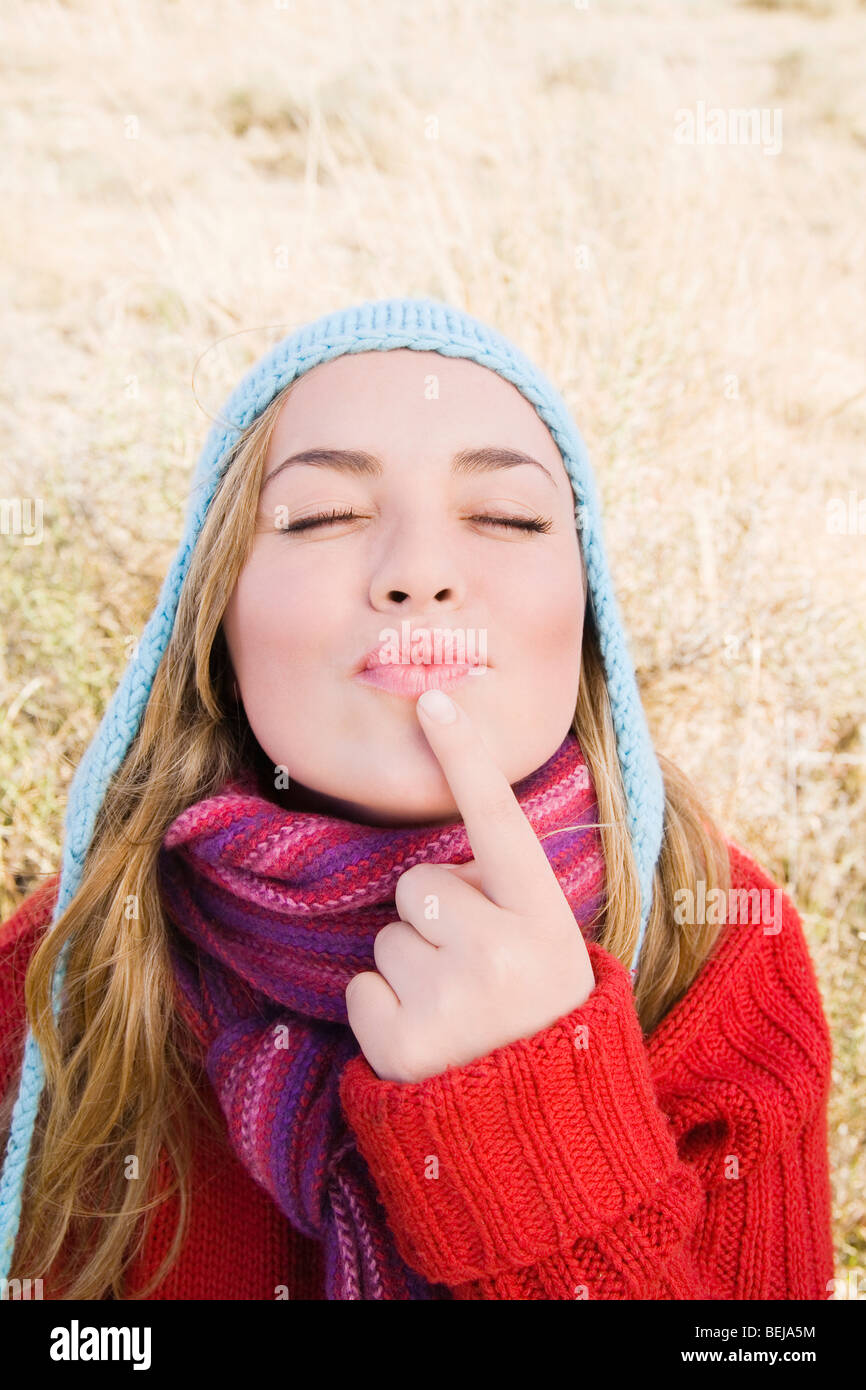 Finger on lips eyes closed hi-res stock photography and images - Alamy