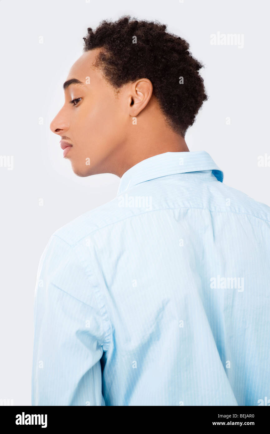 Rear view of a young man thinking Stock Photo - Alamy