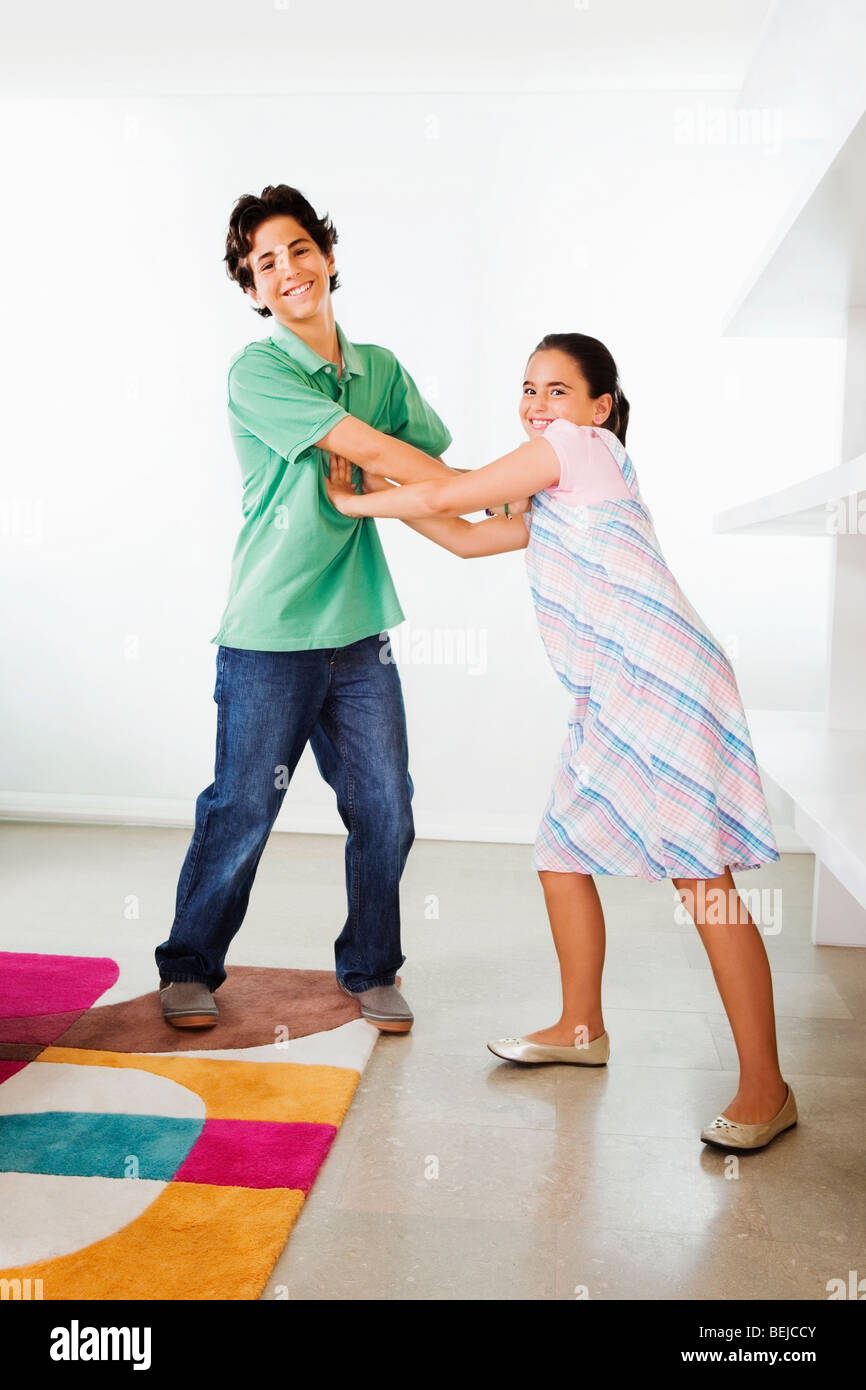 Boy having a play fighting with his sister Stock Photo - Alamy