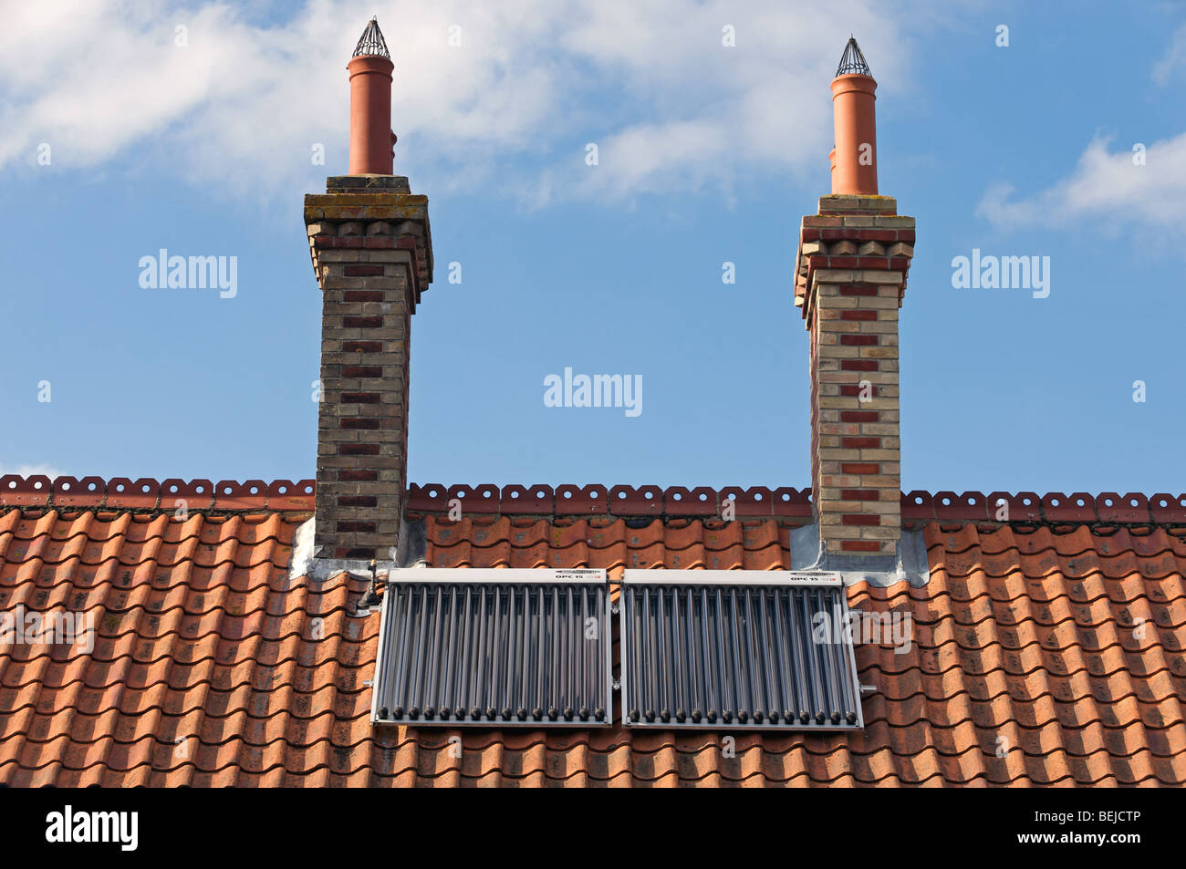 Evacuated solar energy tubes fitted to the rooftop of a house in ...