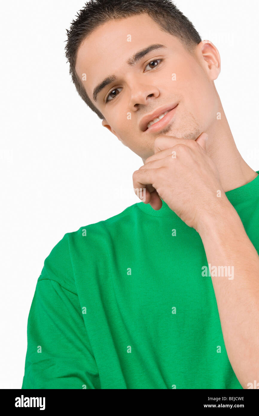 Portrait of a young man thinking Stock Photo - Alamy