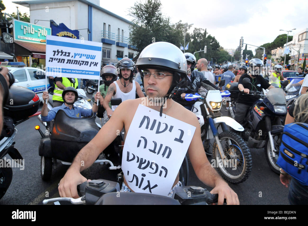 A procession of motorcycles drive through Horev center in Haifa in ...