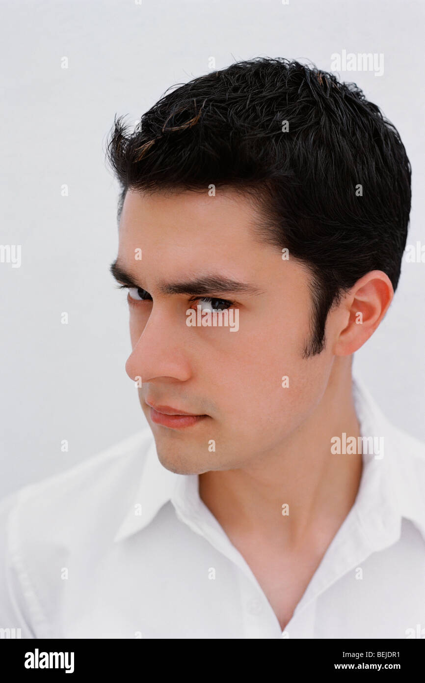 Young latin man staring camera hi-res stock photography and images - Alamy