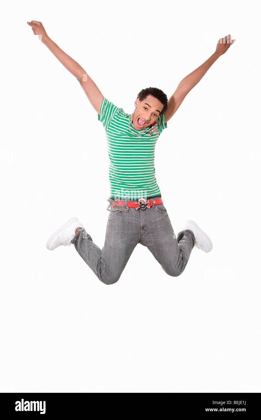 Young man jumping Stock Photo - Alamy