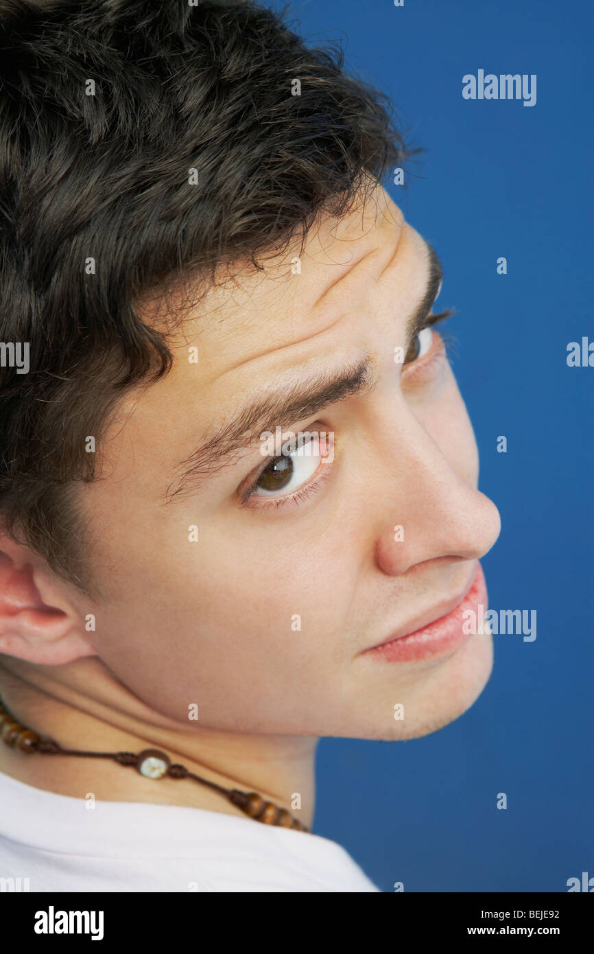 Young man looking back Stock Photo - Alamy