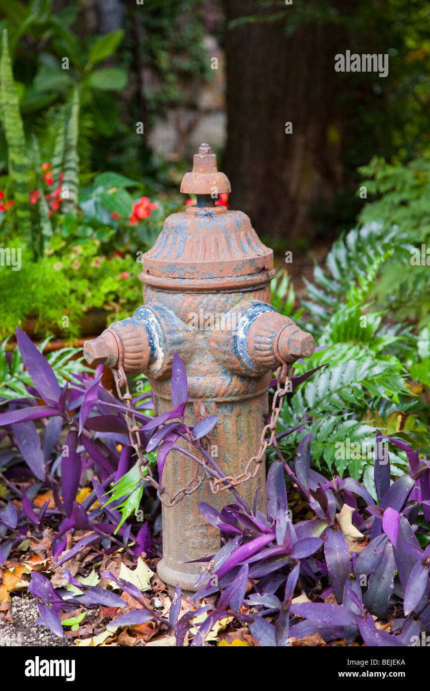 Painted fire hydrant in a garden Stock Photo - Alamy