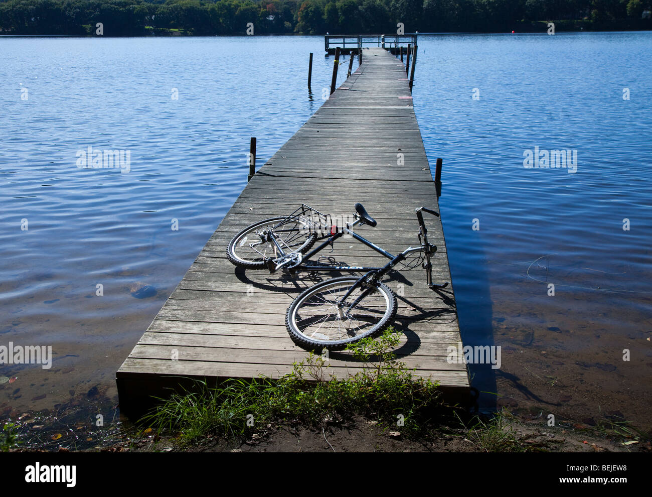 Bicycle on a dock Stock Photo - Alamy