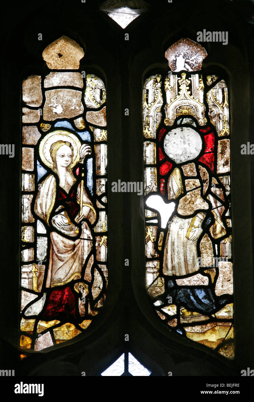 Detail of the medieval stained glass window depicting St Agatha, left ...