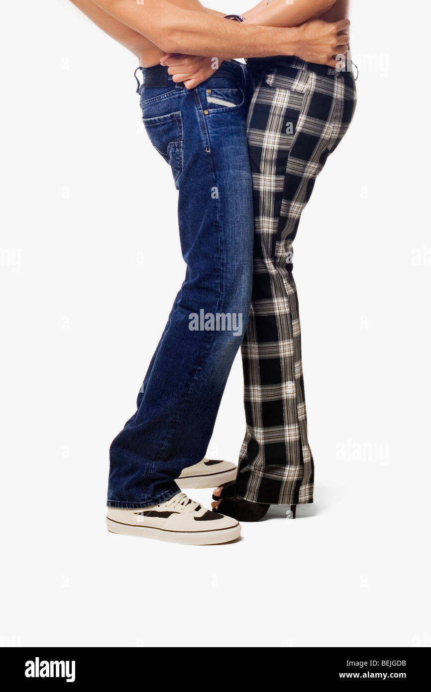 Mid section view of a young couple standing together Stock Photo - Alamy