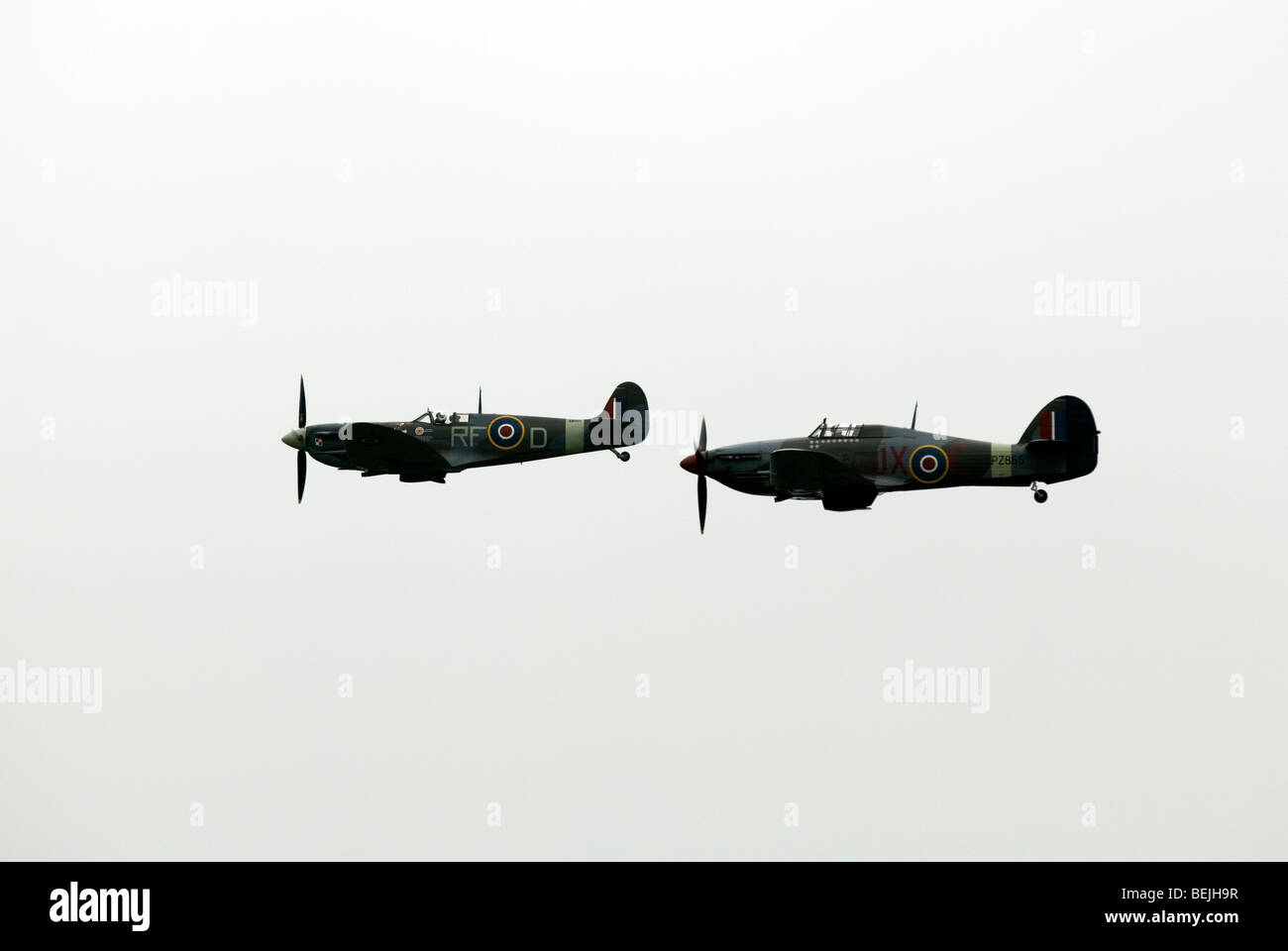 two spitfire planes flying Stock Photo - Alamy