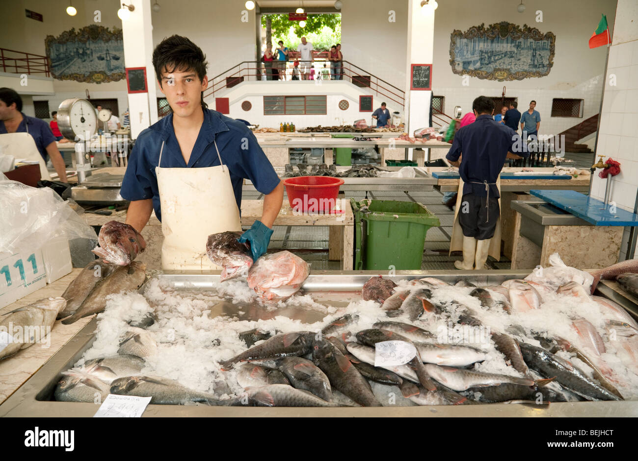 Fishmongers selling fish at the fish market, Funchal, Madeira Stock ...