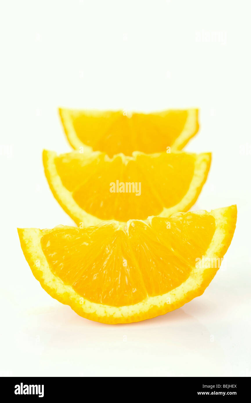 Orange quarters isolated against a white background Stock Photo - Alamy