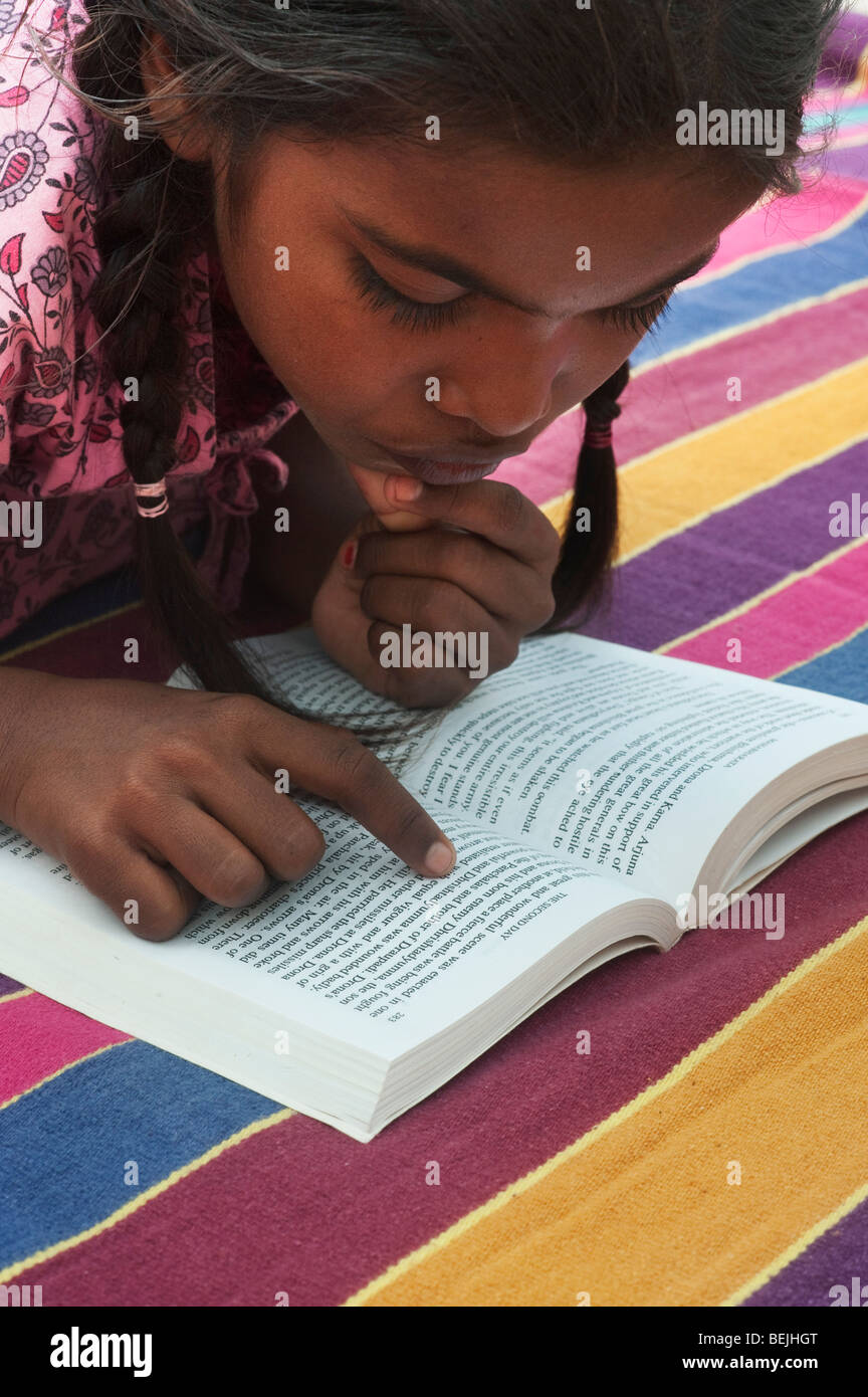 Young Indian girl reading an english language text book. Andhra Pradesh ...