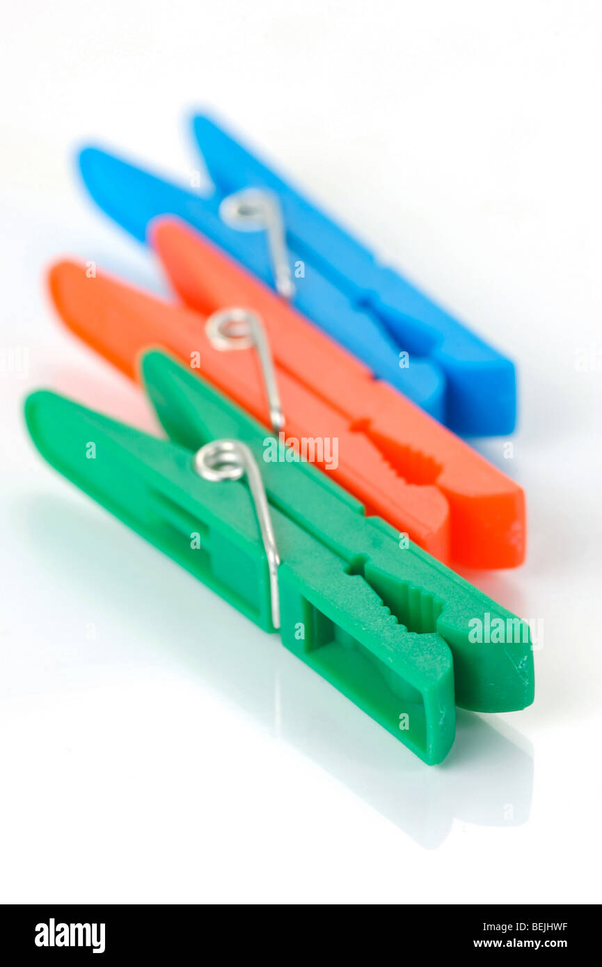 Clothes line pegs isolated against a white background Stock Photo - Alamy