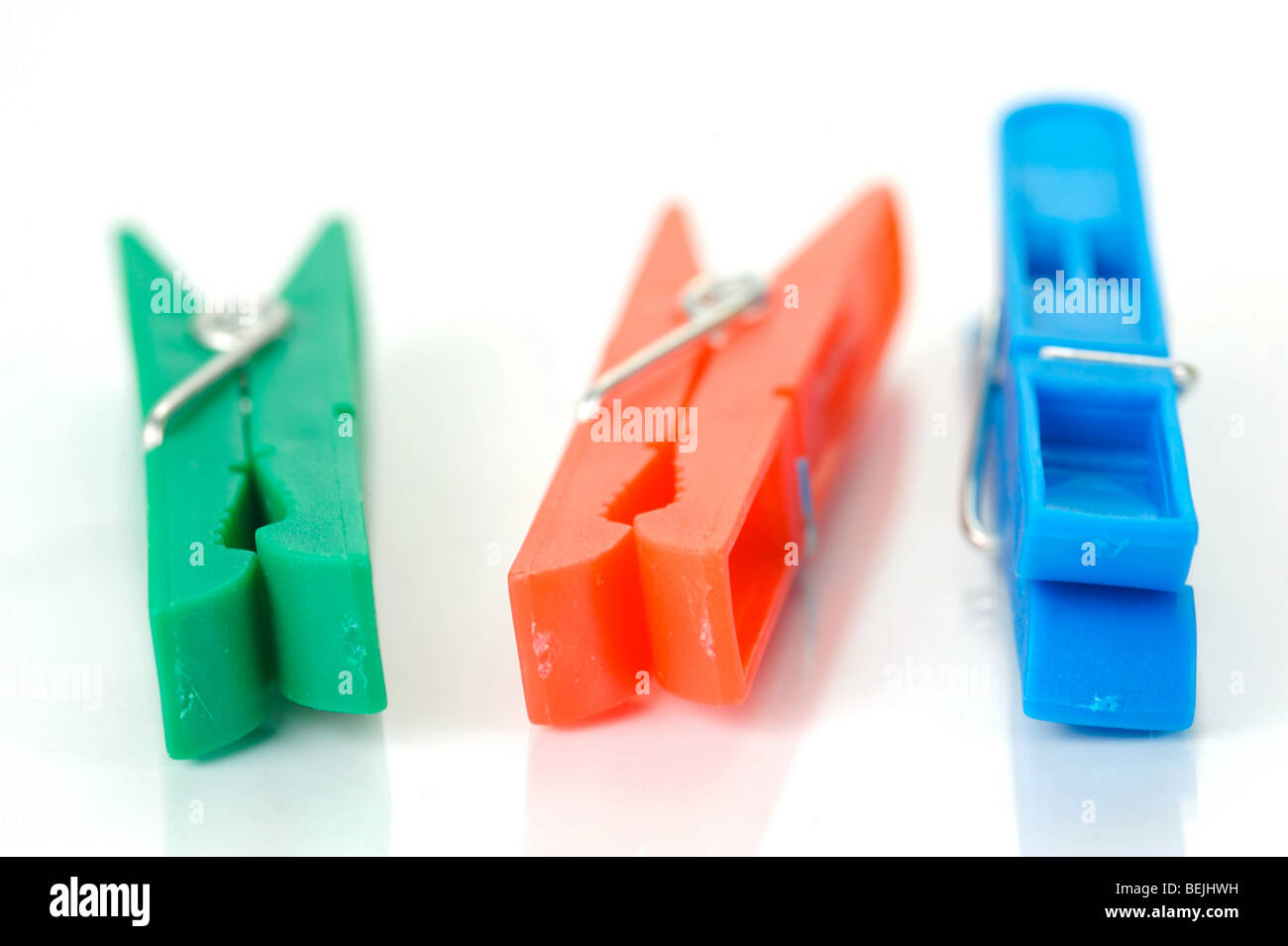 Clothes line pegs isolated against a white background Stock Photo - Alamy