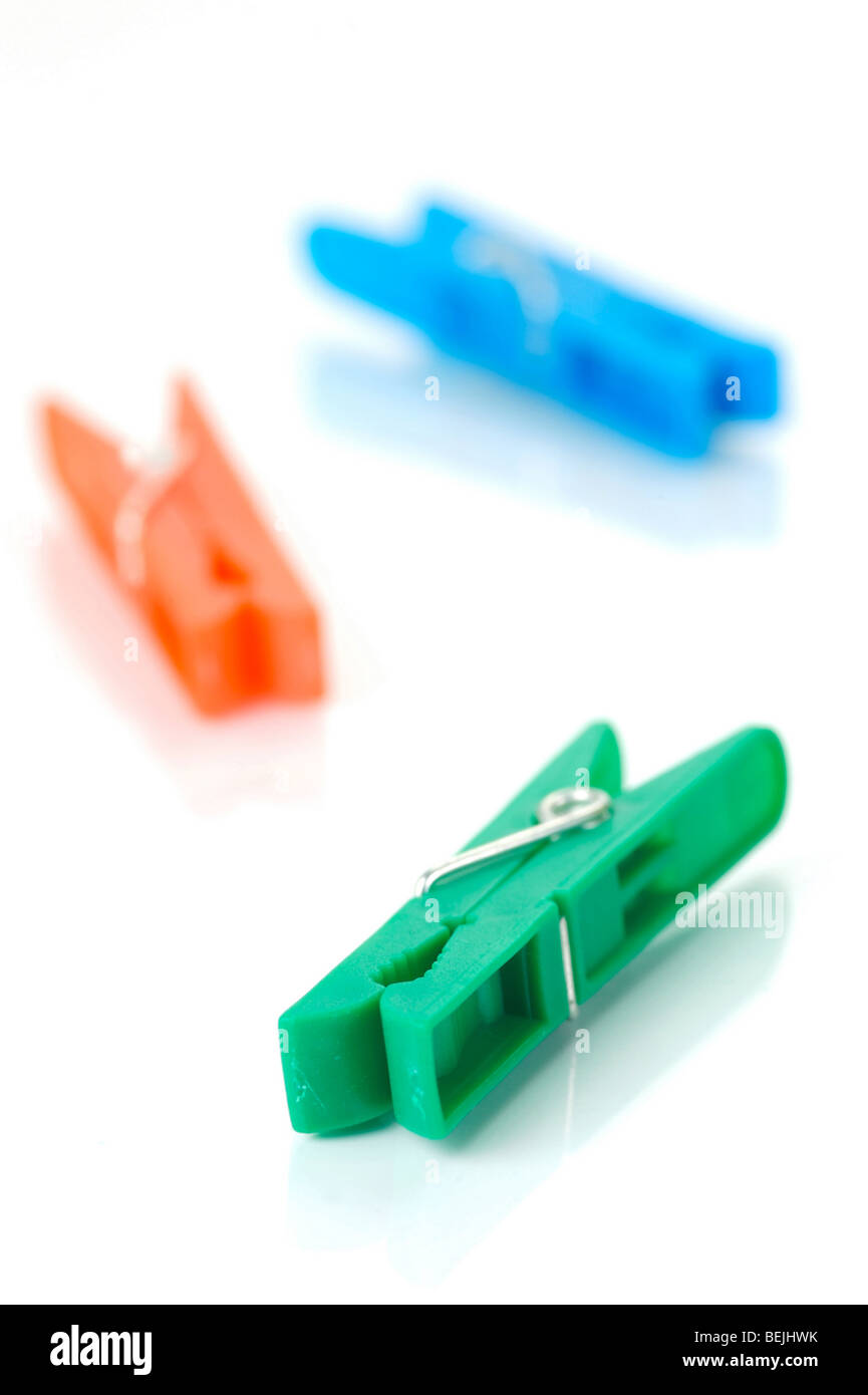 Clothes line pegs isolated against a white background Stock Photo - Alamy