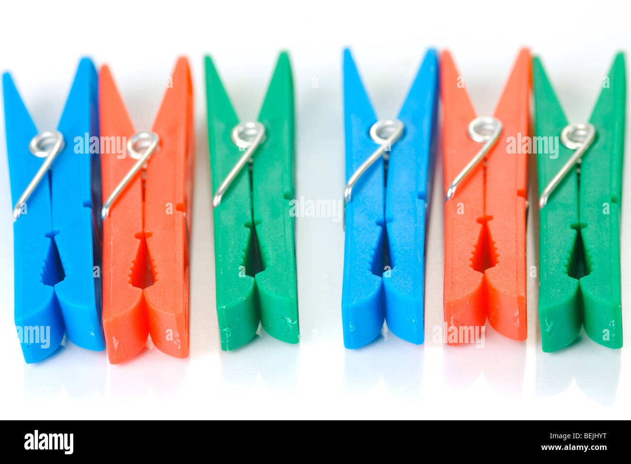 Clothes line pegs isolated against a white background Stock Photo - Alamy