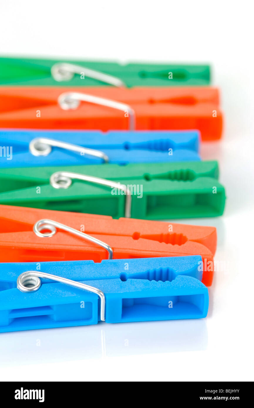 Clothes line pegs isolated against a white background Stock Photo - Alamy