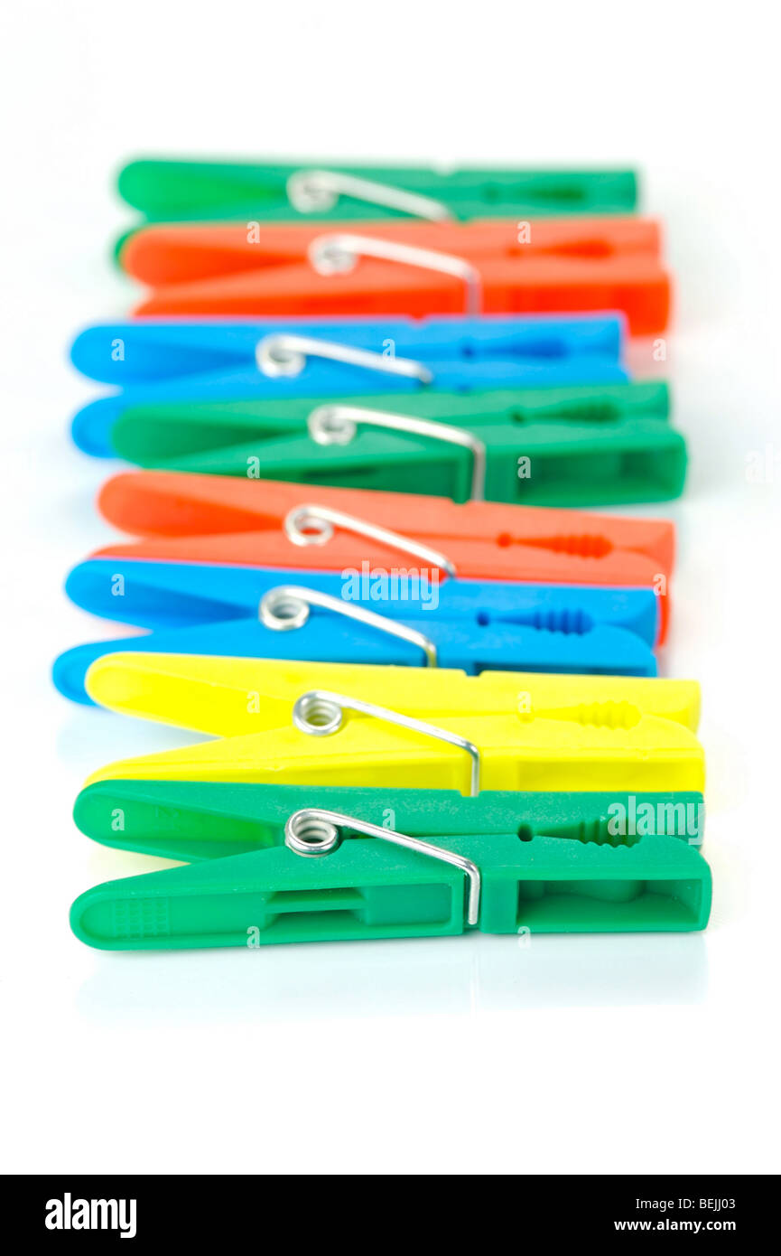 Clothes line pegs isolated against a white background Stock Photo - Alamy