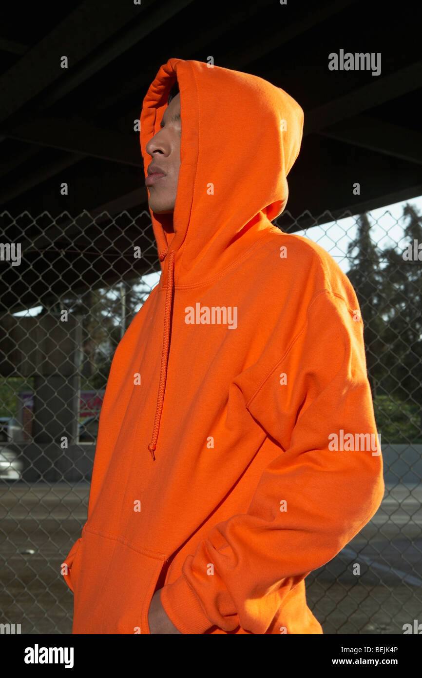 Side profile of a young man wearing a hooded shirt Stock Photo - Alamy