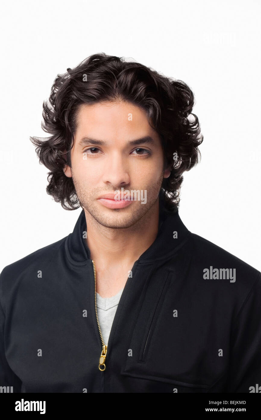 Portrait of a young man thinking Stock Photo - Alamy