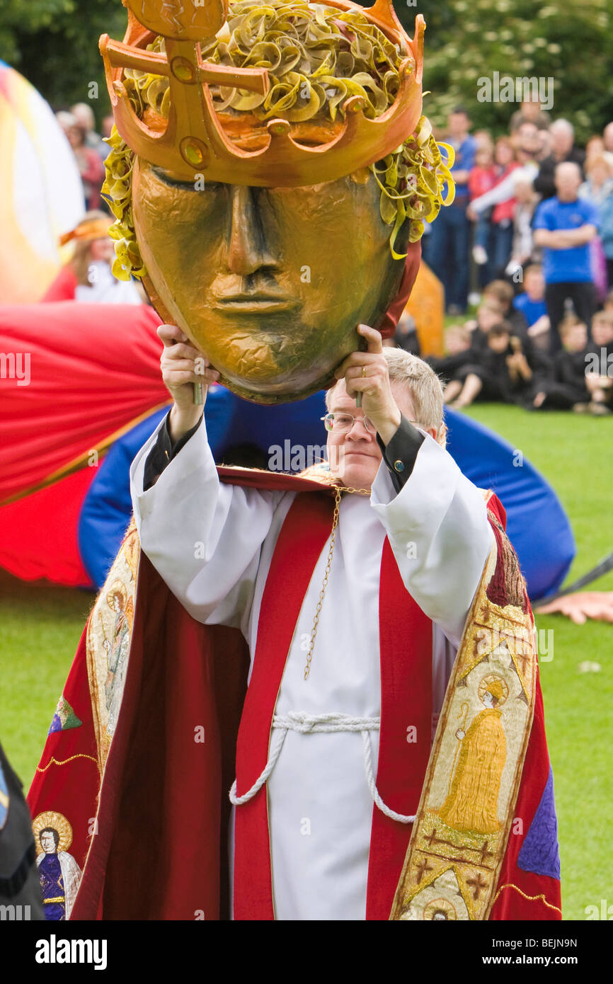 Dean of St Albans Very Revd Dr Jeffrey John holds aloft model of head ...