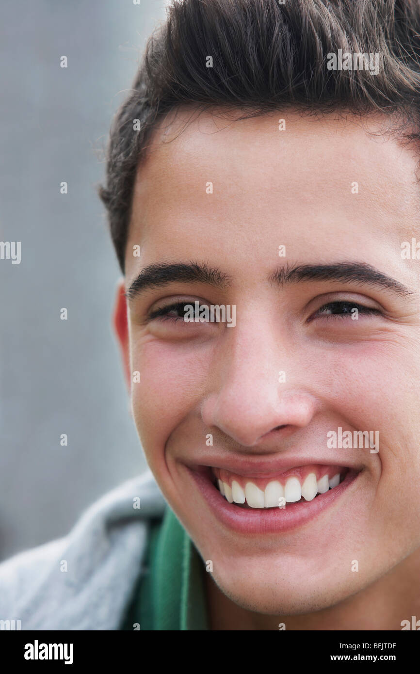 Portrait of a teenage boy smiling Stock Photo - Alamy