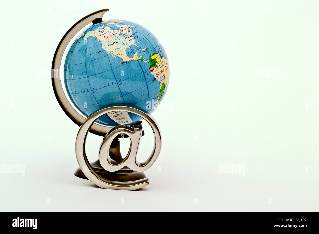 E-mail symbol in front of a small globe of the world Stock Photo - Alamy