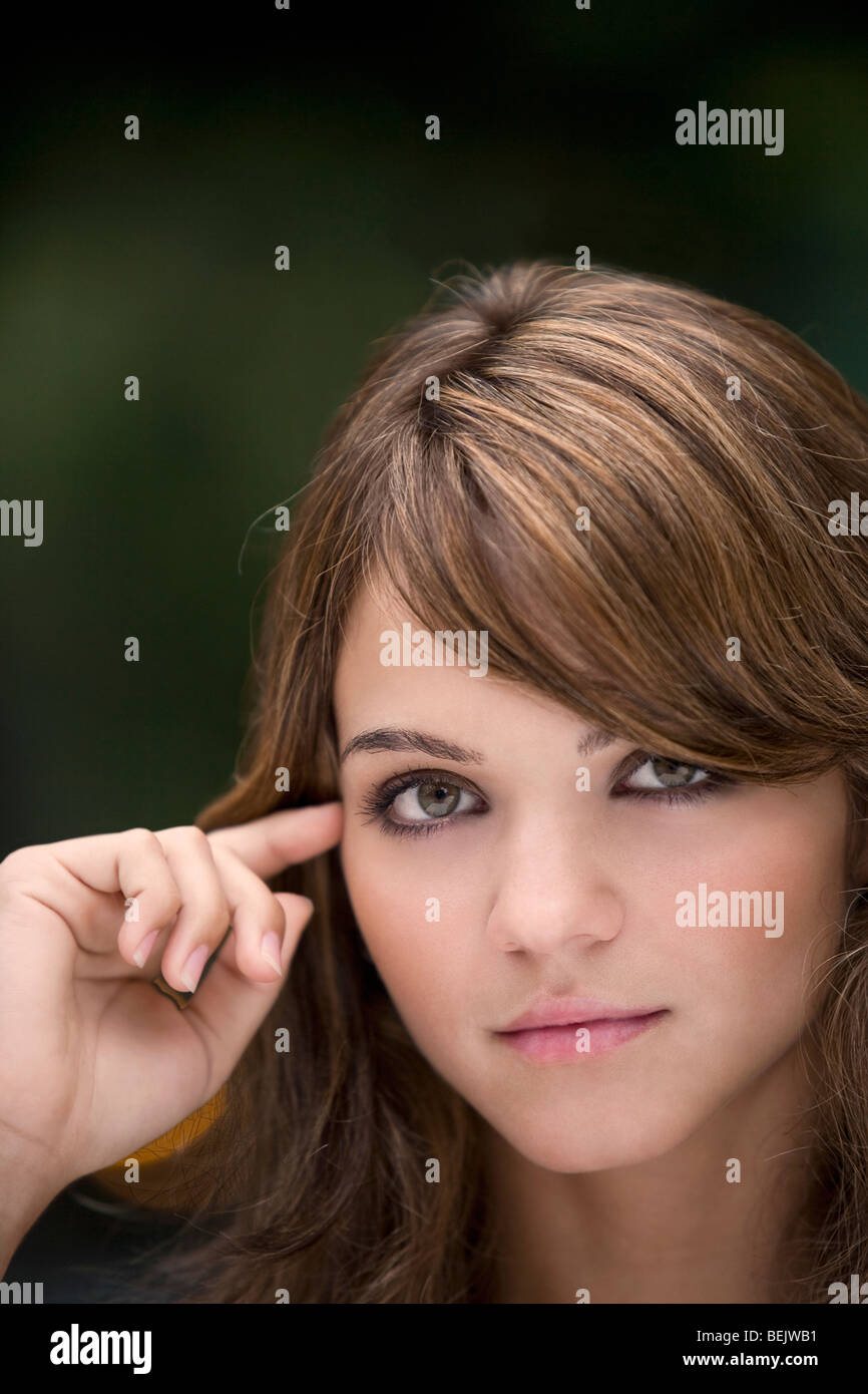 Portrait of a young woman thinking Stock Photo - Alamy