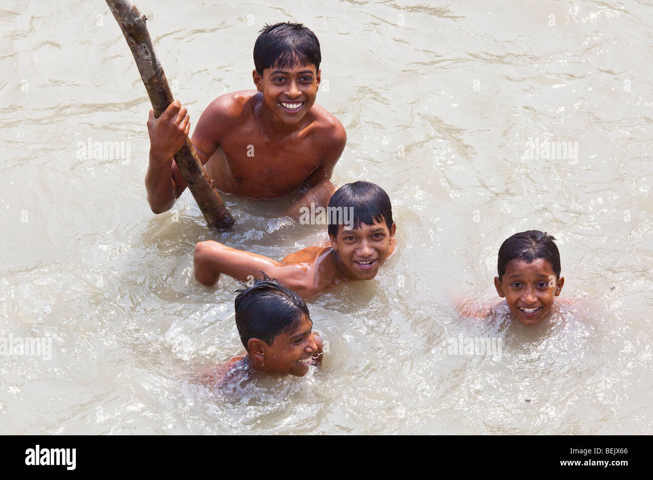 Boy Swimming In River