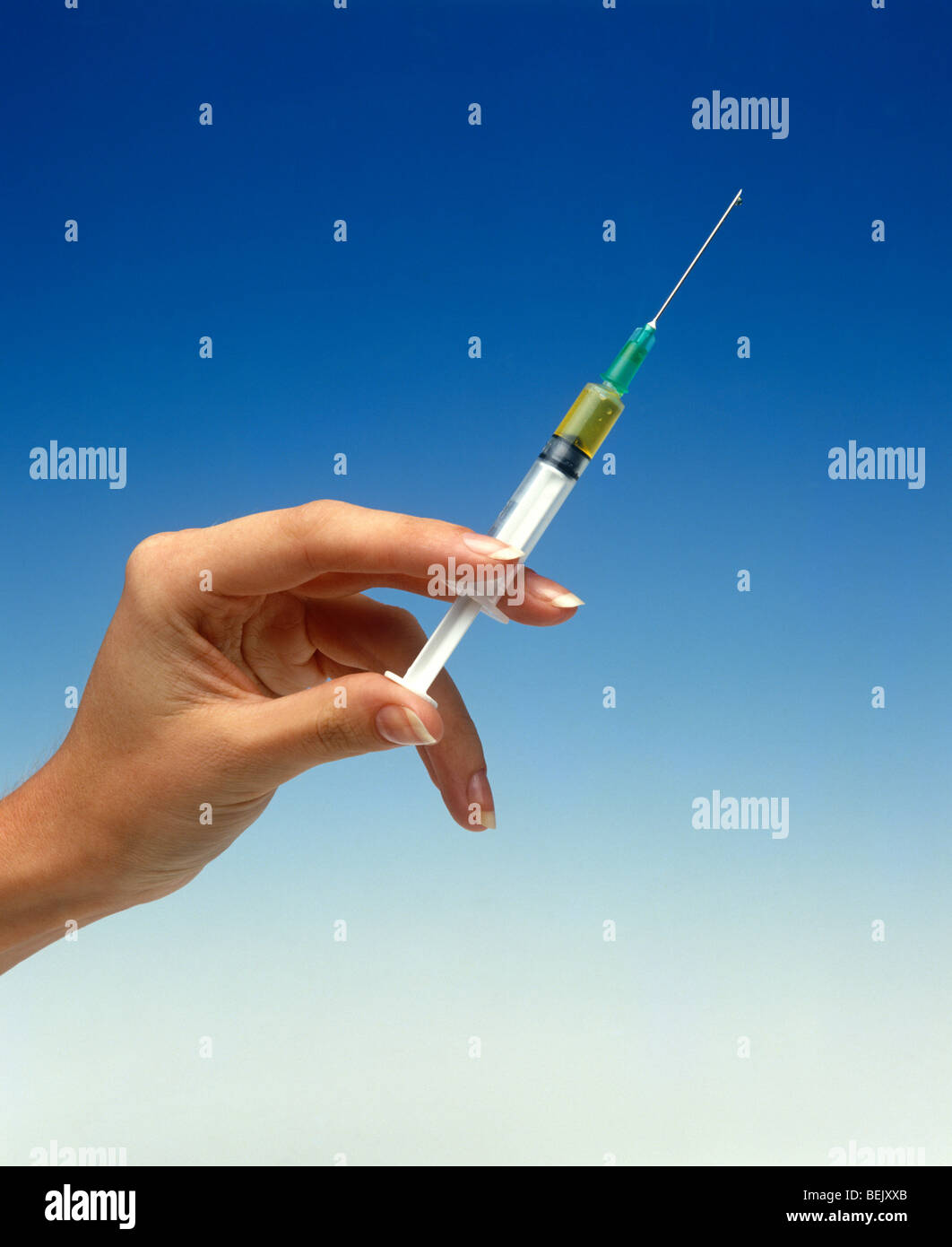Hand with syringe Stock Photo - Alamy