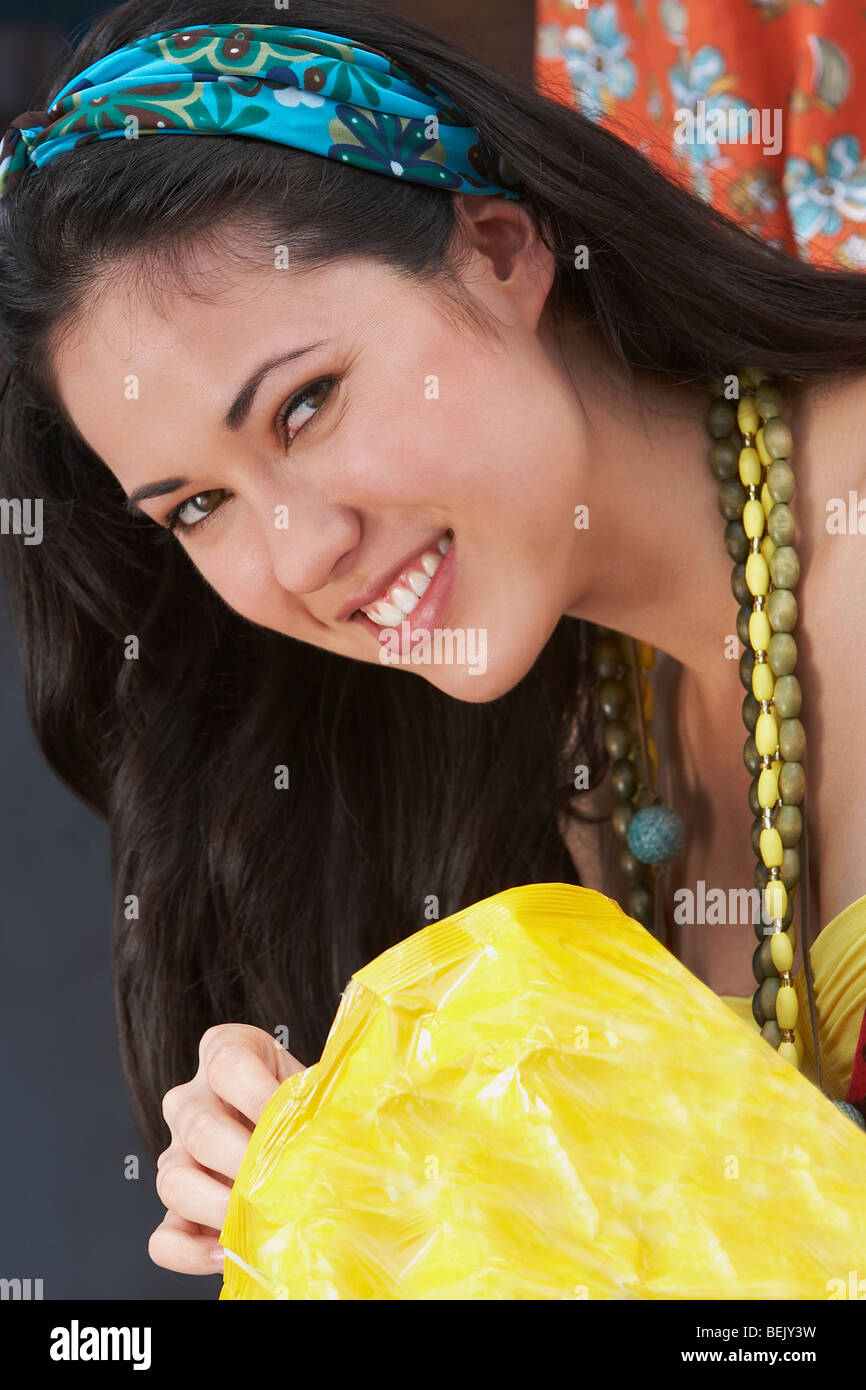 Holding chip packet hi-res stock photography and images - Alamy