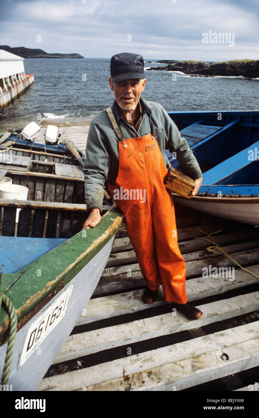 North America, Canada, Maritimes, Newfoundland, fisherman standing ...