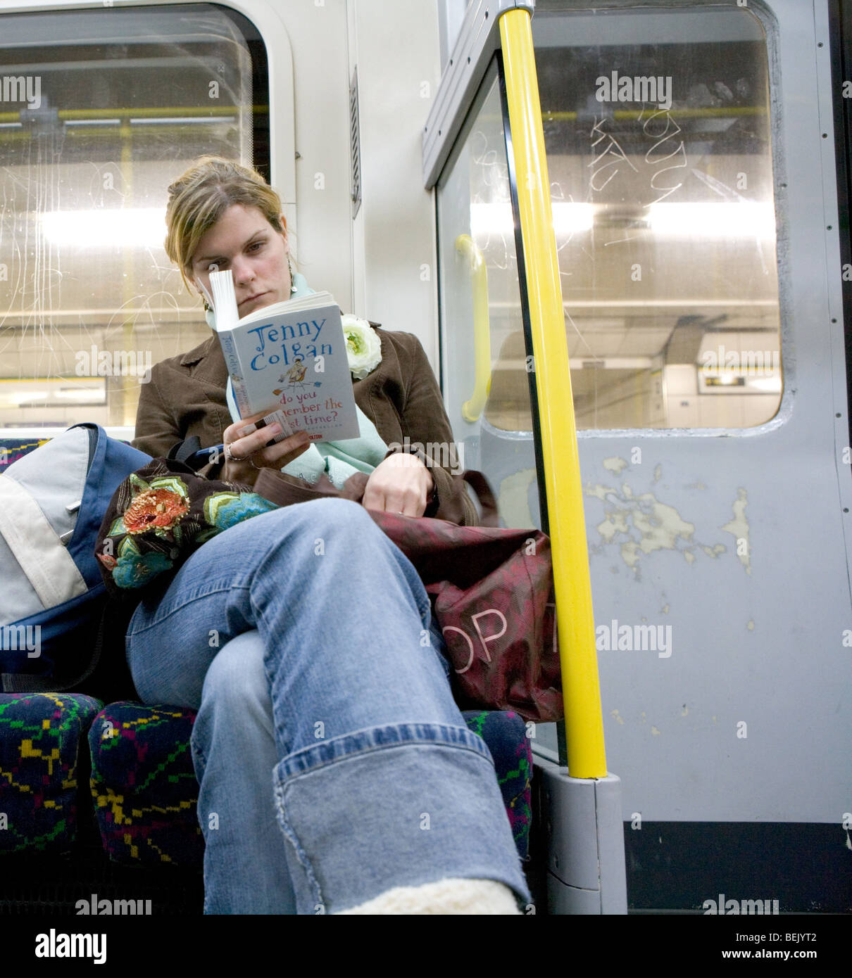 Woman reading book on a train hi-res stock photography and images - Alamy