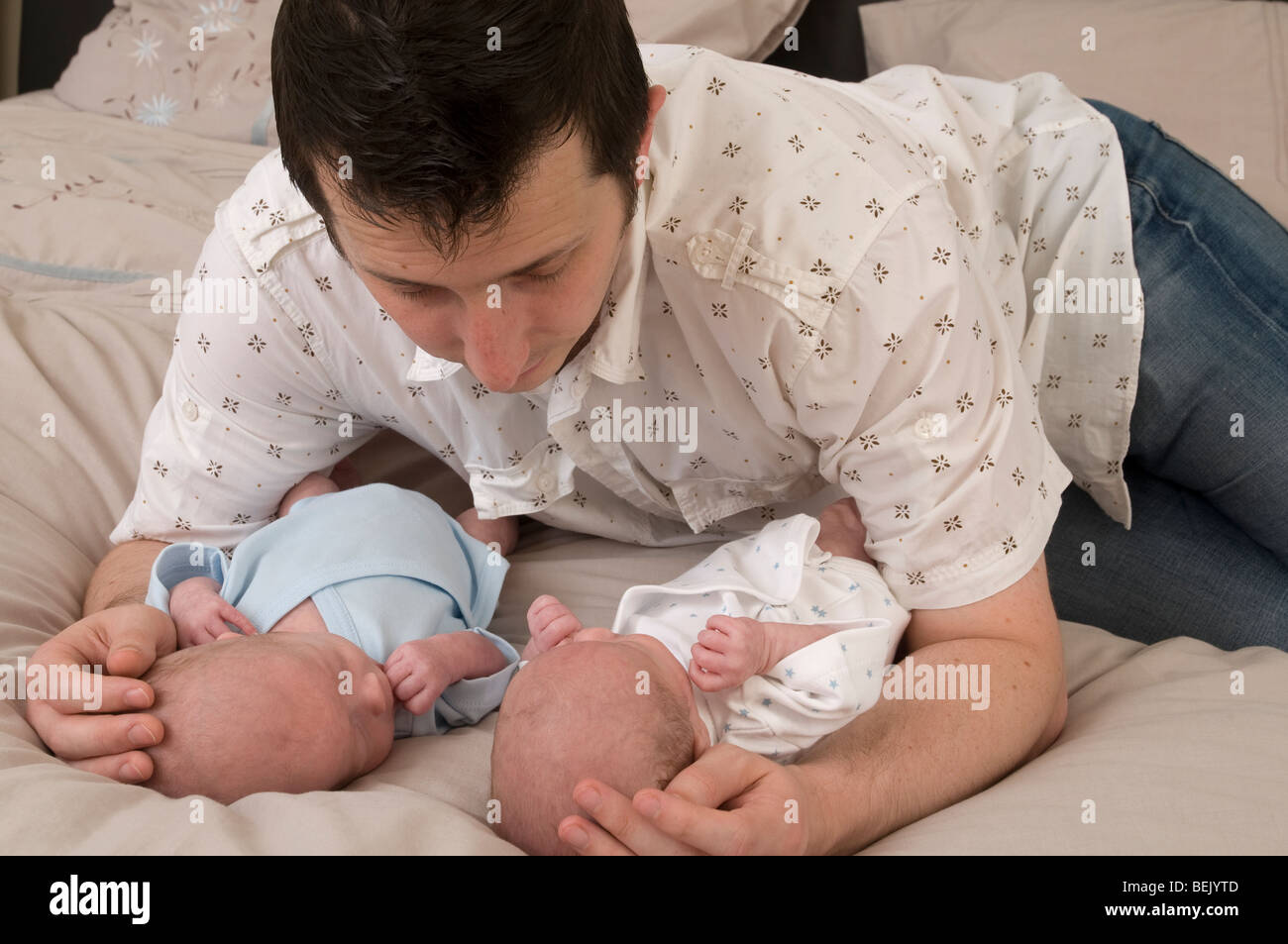 Parent touching babies twins hi-res stock photography and images - Alamy