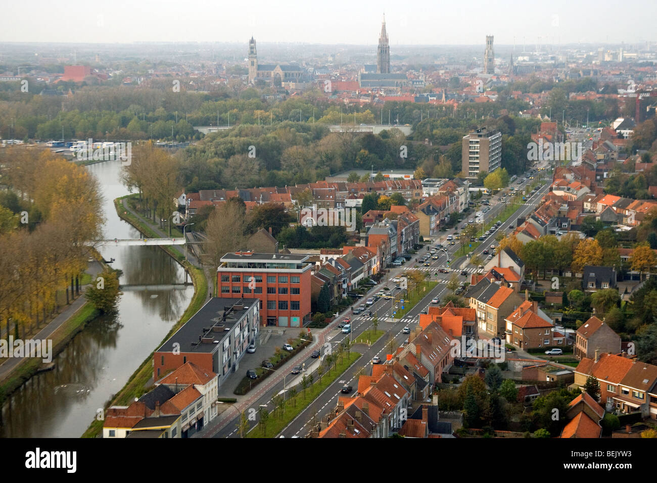 Aerial view over the city Bruges with canal, access roads and suburbs ...