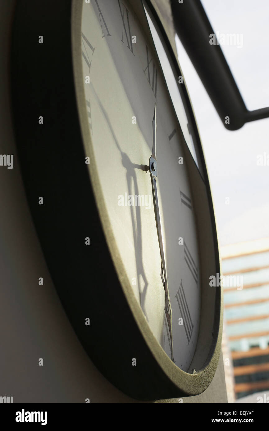 Close-up of a clock hanging on a wall Stock Photo - Alamy