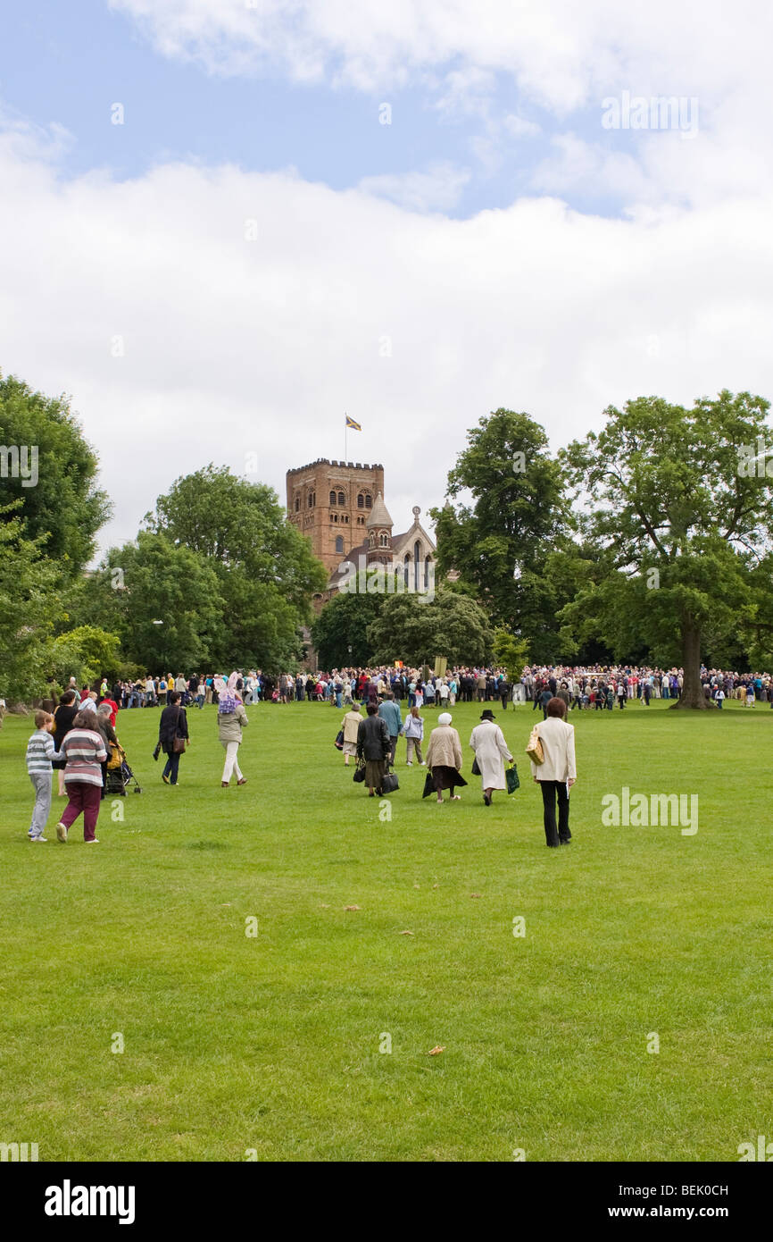 People walking towards St Albans Abbey during Albantide pilgrimage ...