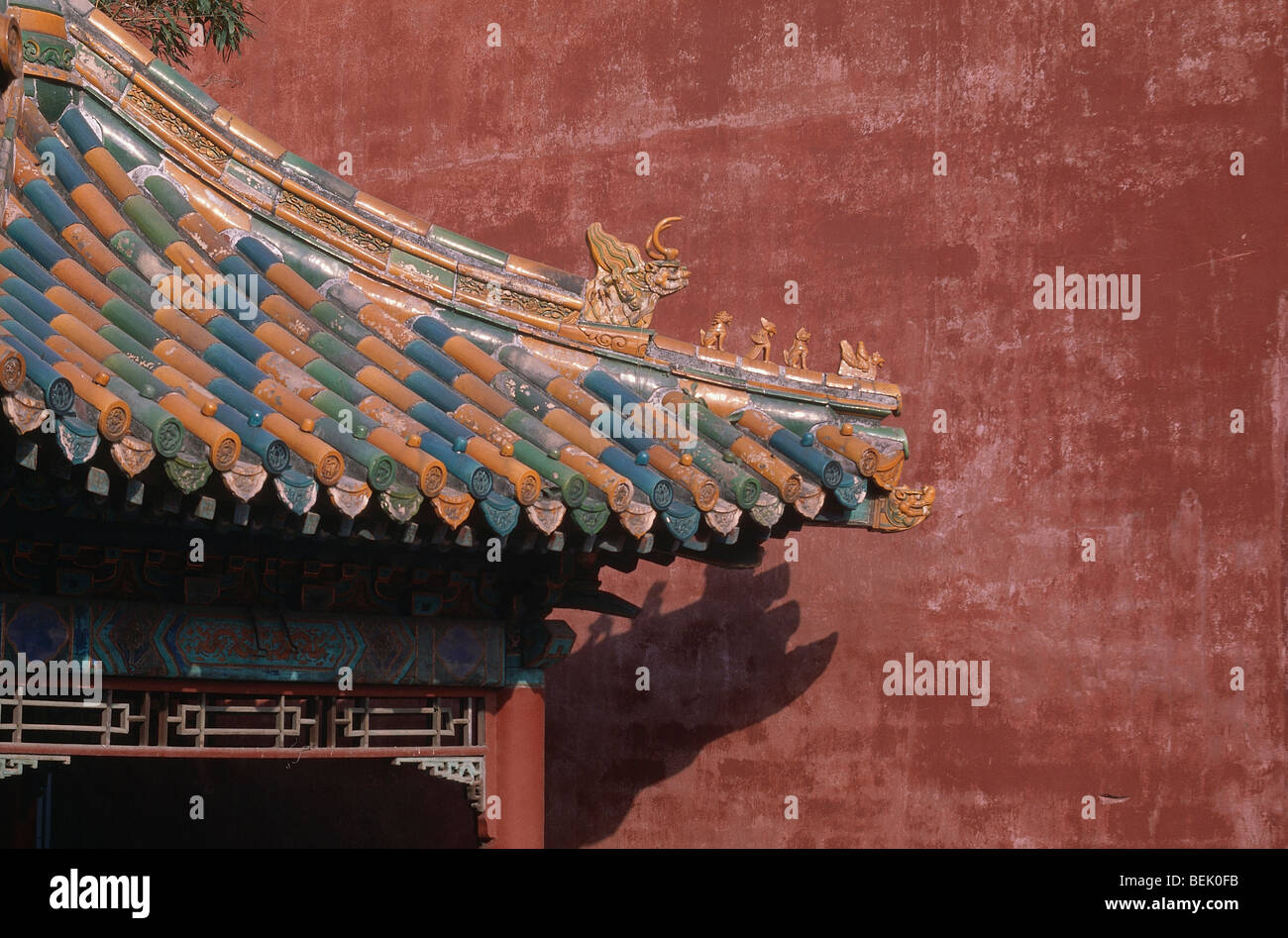 The Forbidden City/ Gugong/ Imperial Palace. Tiled roof corner. Green ...