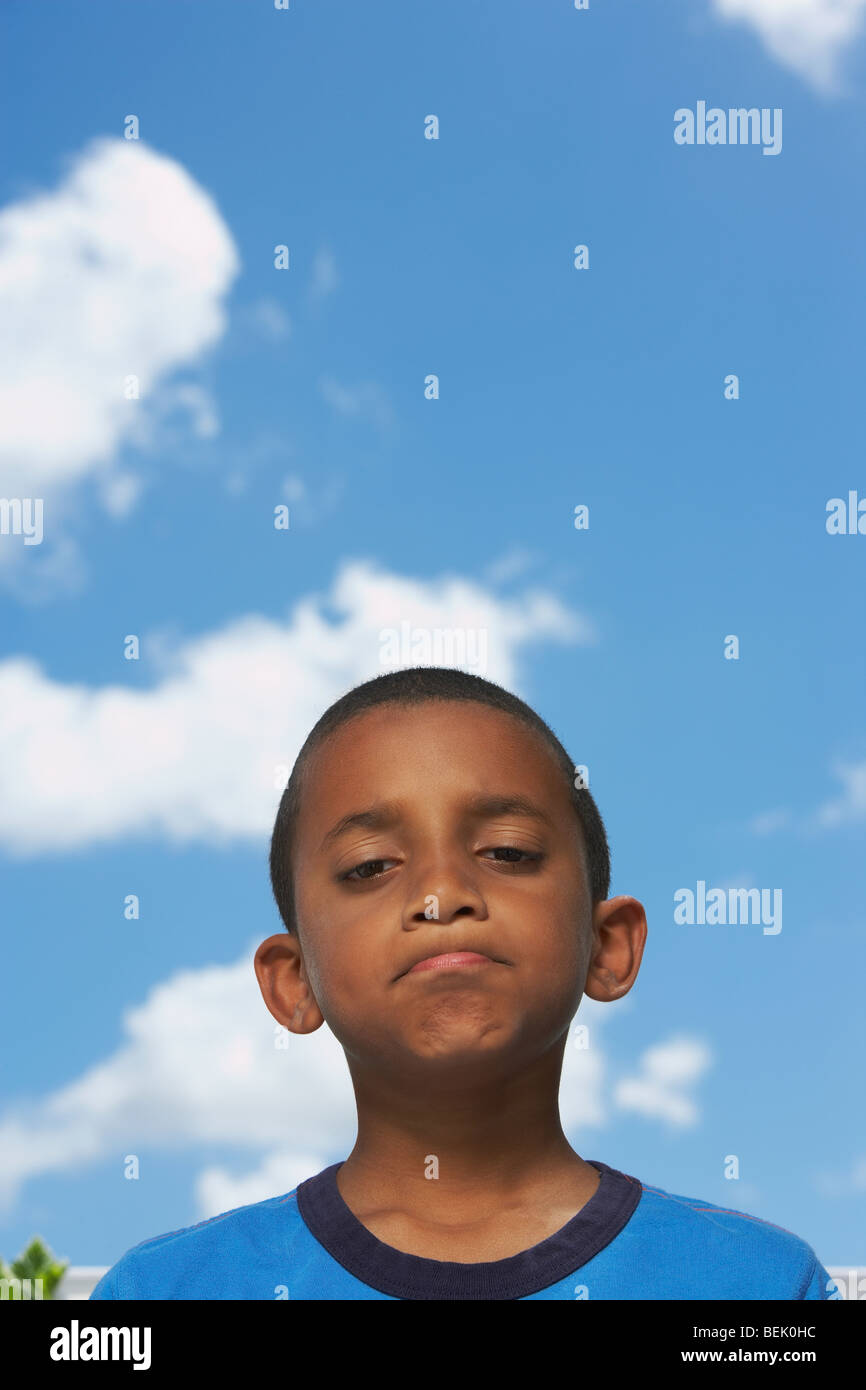 Portrait of a boy making a face Stock Photo - Alamy