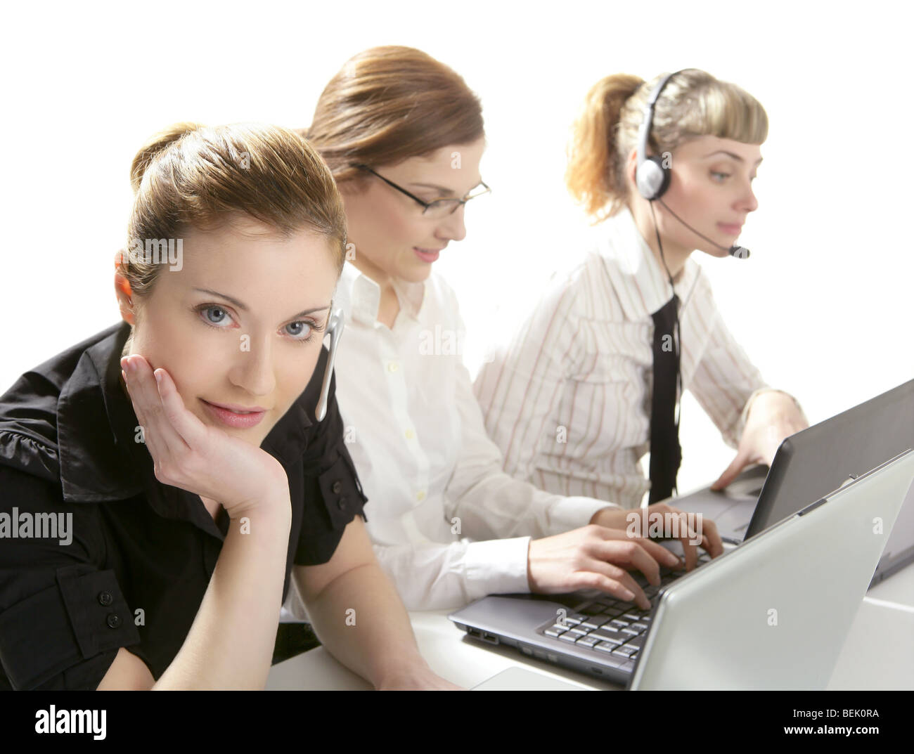 Three businesswoman customer support help desk isolated on white studio ...