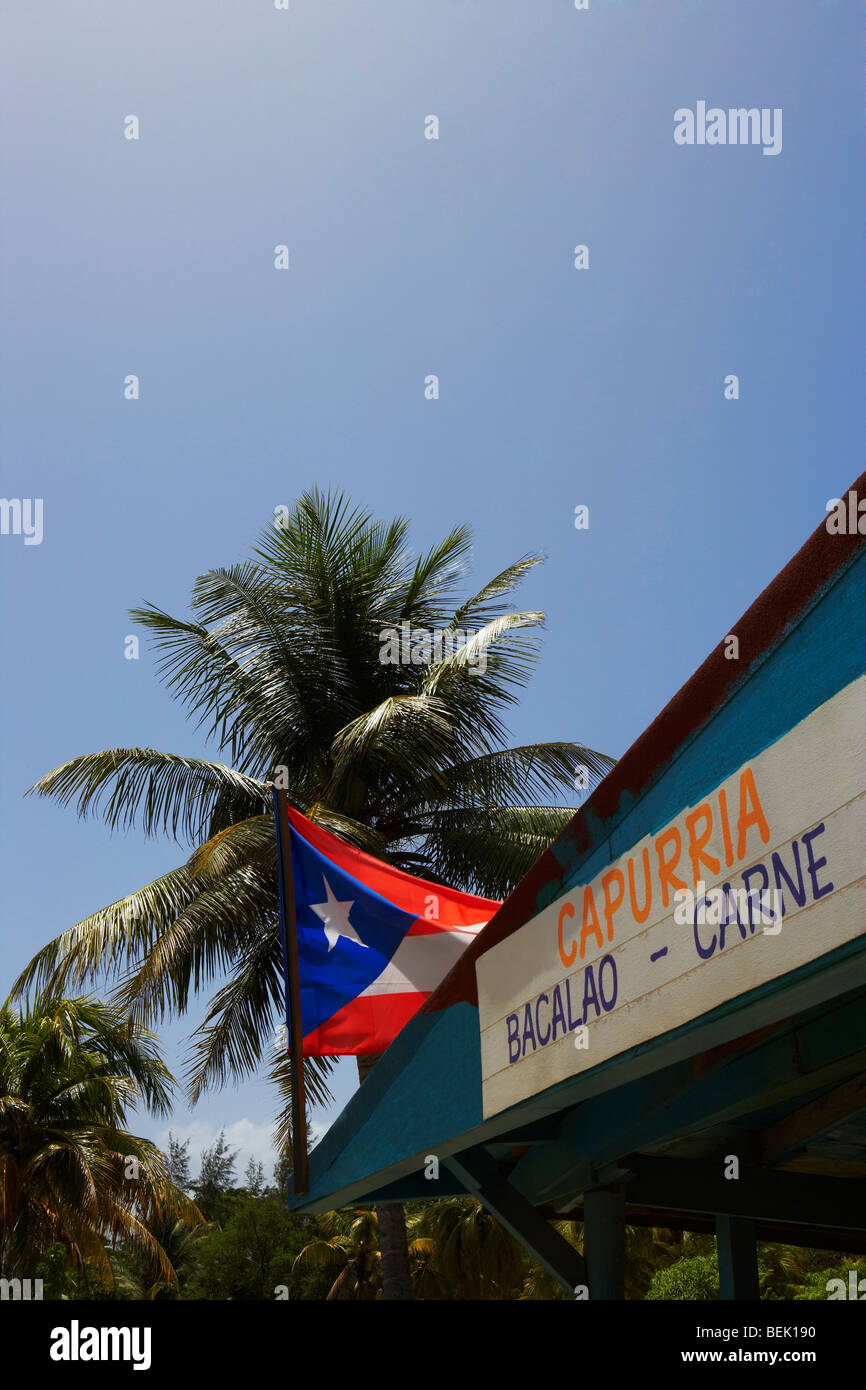 Low angle view of a Puerto Rican flag shade on the roof of a restaurant ...