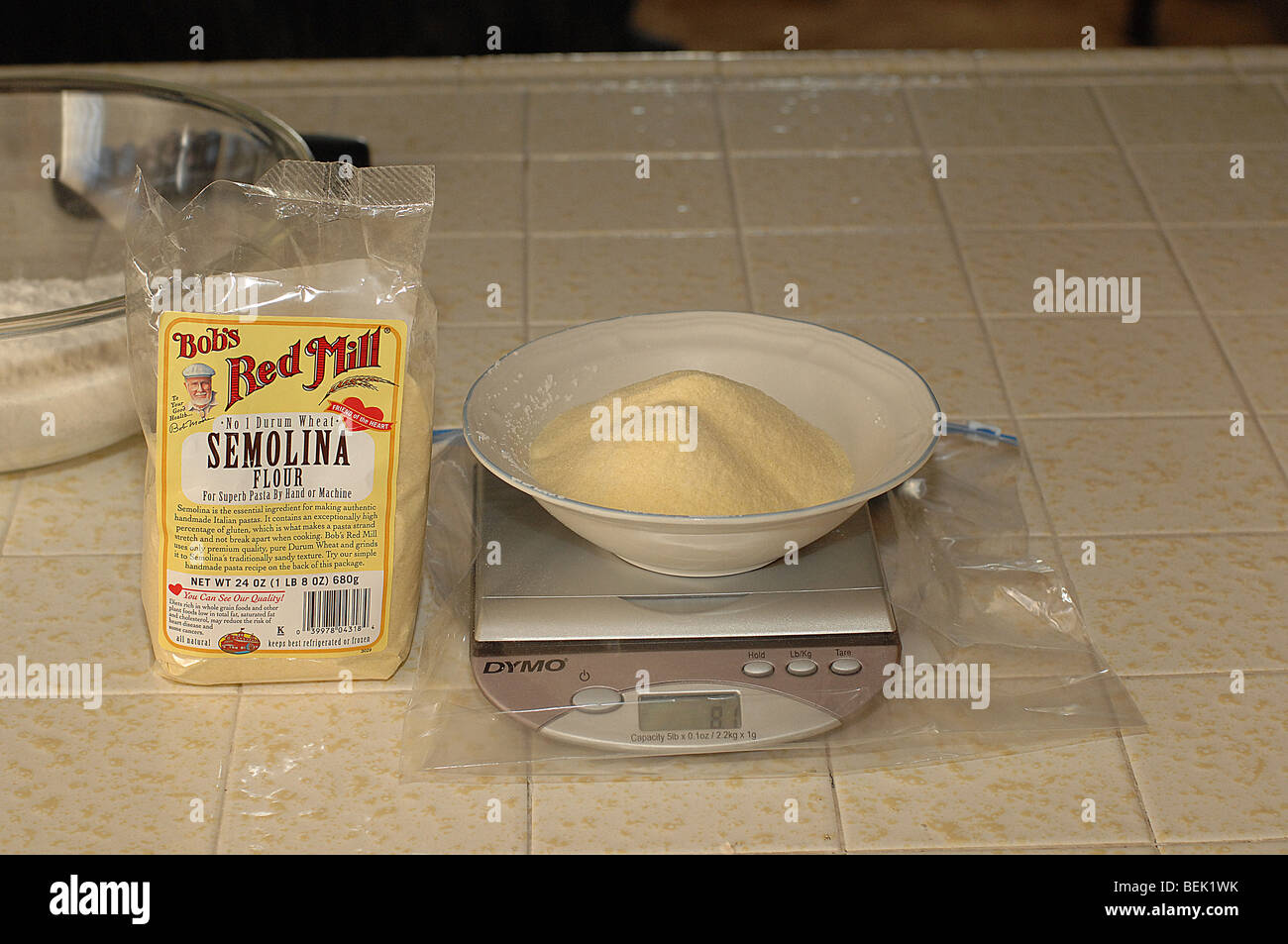 Carefully weigh ingredients. Dough in preparation for baking pane ...