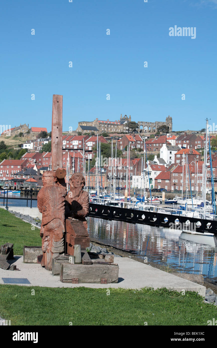 Sculpture of shipbuilders on the quayside at Whitby with The Abbey ...
