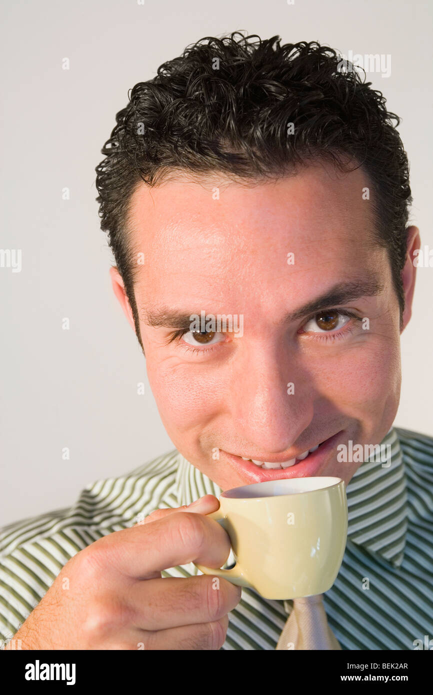 Portrait of a businessman drinking a cup of tea Stock Photo - Alamy