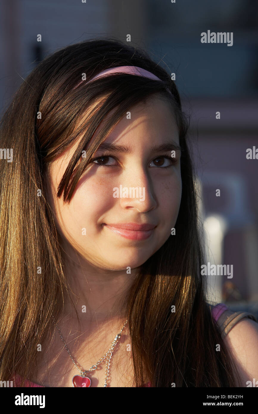 Close-up of a girl grinning Stock Photo - Alamy